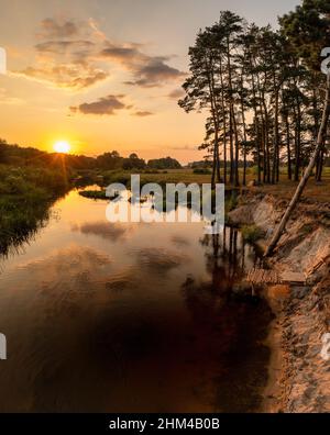 A beautiful and tranquil river scene at sunset, showcasing the stunning ...