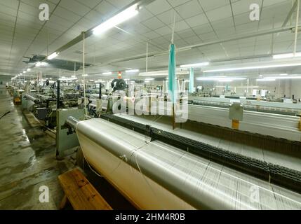 Silk reeling workshop processing Stock Photo - Alamy