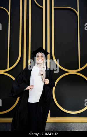 Smiling woman wearing graduation hat Stock Photo - Alamy