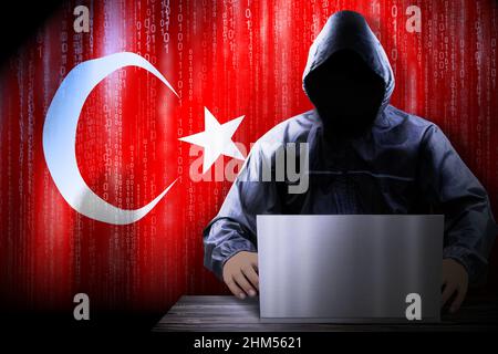 Anonymous hooded hacker, flag of Turkey, binary code - cyber attack concept Stock Photo - Alamy