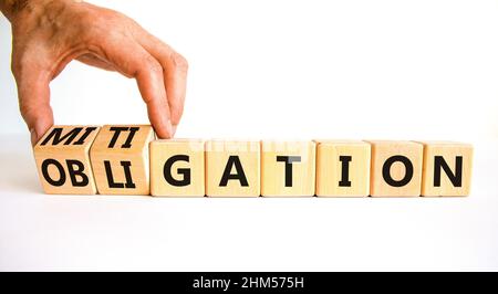 Obligation and mitigation symbol. Businessman turns wooden cubes ...