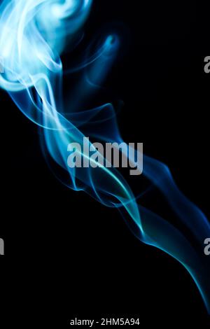 beautiful blue puffs from cigarette smoke Stock Photo - Alamy