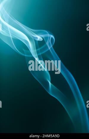 beautiful blue puffs from cigarette smoke Stock Photo - Alamy