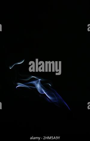 beautiful blue puffs from cigarette smoke Stock Photo - Alamy