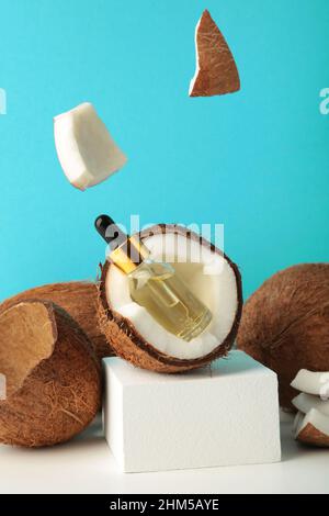 Coconut oil and oil bottle on wooden table Stock Photo - Alamy