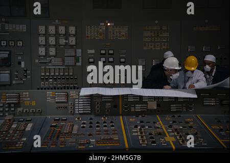 Workers decipher complex diagrams in control room 3 at the Chernobyl ...
