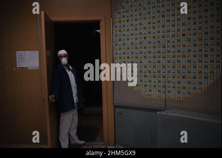 Chernobyl reactor 3 control room. Worker sat at the control panel of ...