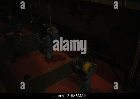 Decommissioned equipment in the shadowy pump room of reactor 3 at the ...