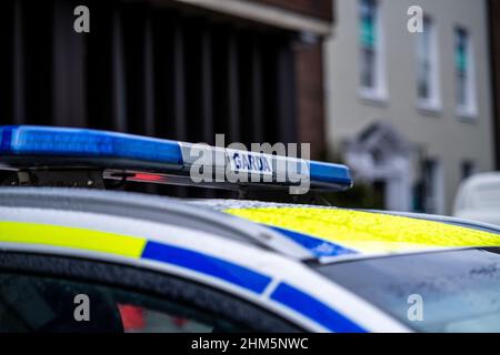 Garda, description on police car, with yellow and blue stripes on sides ...