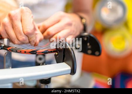 badminton racket repair and weaving Stock Photo - Alamy