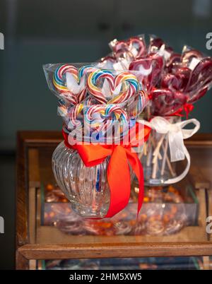 Colorful heart-shaped lollipops for sale on candy shop on Happy ...