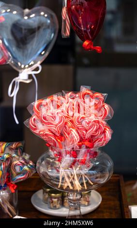 Colorful heart-shaped lollipops for sale on candy shop on Happy ...