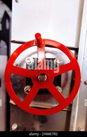 Round red valve close-up. Industrial background. Gasification or ...