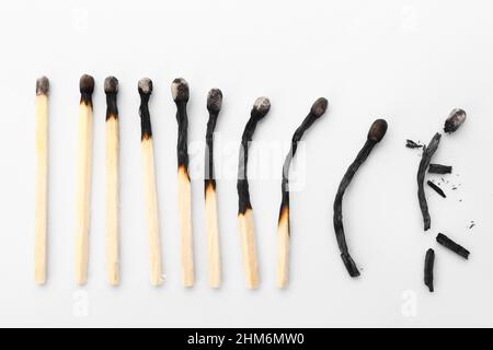 Different stages of burnt matches on white background, flat lay Stock ...