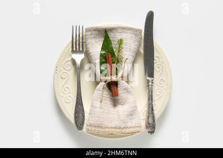 Stylish simple table setting and cinnamon on white background Stock ...