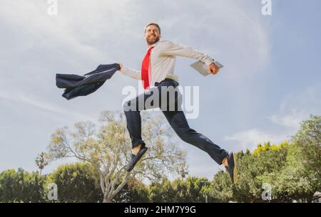 Excited businessman running fast, racing and jumping Stock Photo - Alamy