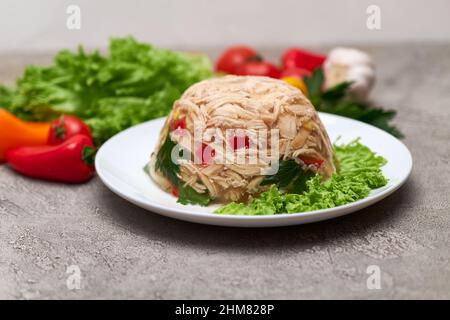 Delicious chicken aspic on a plate on concrete table Stock Photo - Alamy