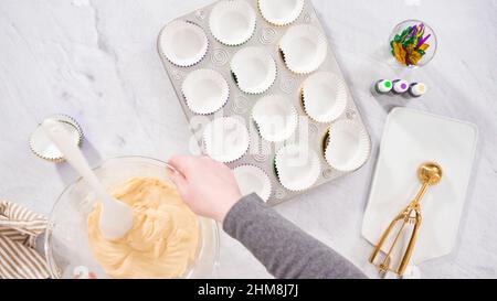 Step by step. Scooping cupcake batter into foil cupcake cups to bake ...