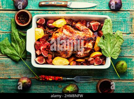 Appetizing whole partridge in a baking dish. Baked chicken Stock Photo ...
