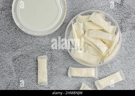 Open box with snus on a concrete background. Swedish nicotine sachets ...