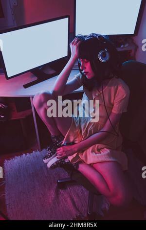 Young streamer woman working at night from home Stock Photo - Alamy
