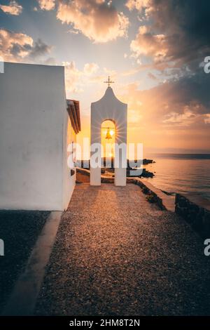 The Church of Agios Nikolaos on Zakyntos, sunrise directly at the sea Stock Photo - Alamy