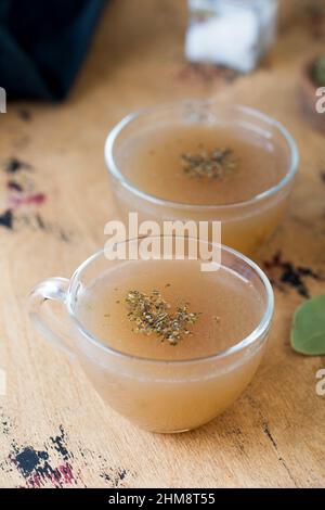 Chicken Stock in Glass Mugs and Bowl Stock Photo - Alamy