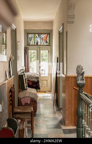 Interior of corridor and shabby tiled floor in retro residential house ...