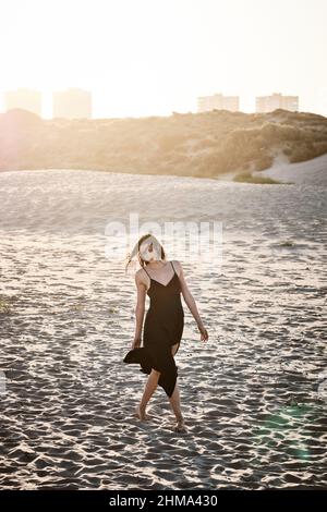 Senior woman wearing sportswear and headphones smiling pointing to head ...