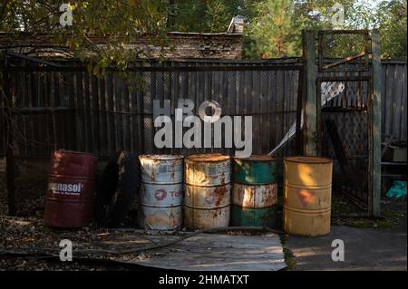 Abandoned facilities, tools, vehicles and garbage lie near the once ...