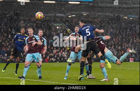 Harry Maguire of Manchester United heads on goal and hits the crossbar ...