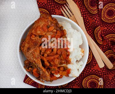 Traditional south African pap and roasted chicken, maize meal with ...