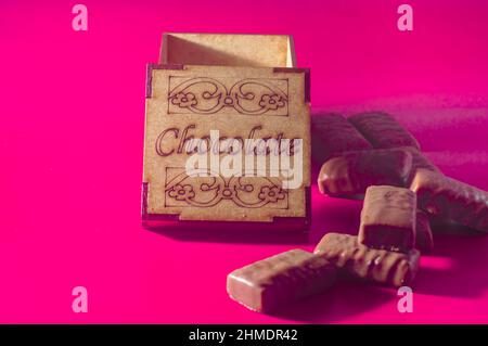 chocolate box written with pink background copy space and selective ...