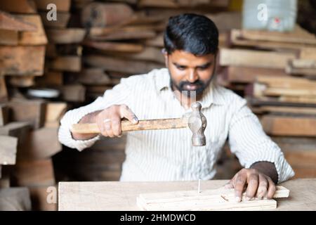 workman occupation concept. workman using hammer tool. workman with ...