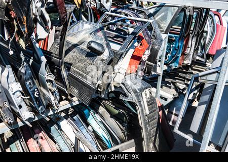 Stacks of old damaged car doors at junkyard Stock Photo - Alamy