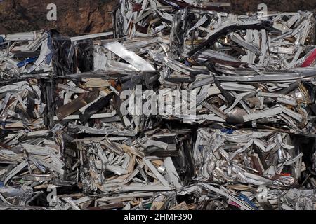 Scrap metal cubes in a scrap yard Stock Photo - Alamy