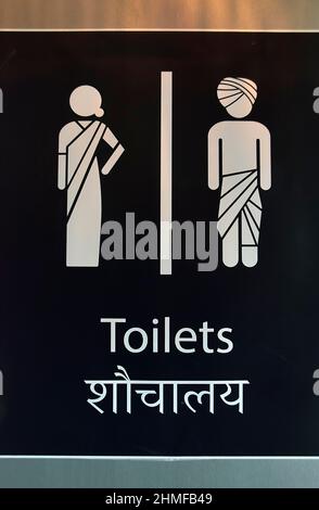 toilet sign in english and hindi blue white letters round board Stock ...