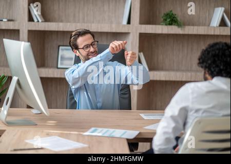 Two businessmen discussing the project details and looking involved ...