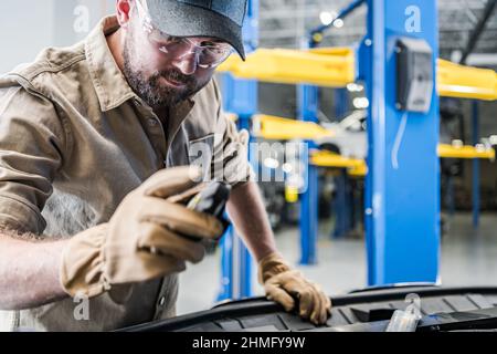 Caucasian Automotive Technician Wearing Eyes Safety Glasses Repairs ...