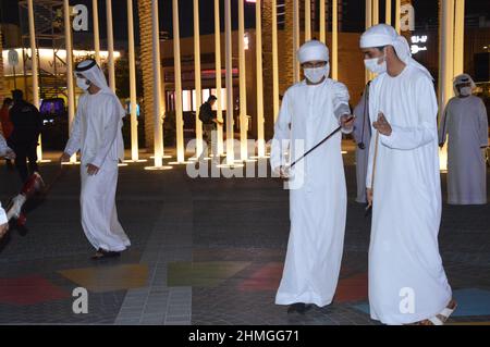 Traditional Arab dancers wearing face masks at Expo 2020 Dubai in ...