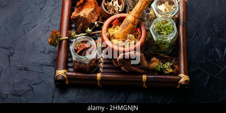 Healing herbs and plants. Set of homeopathic herbs in a wooden tray ...