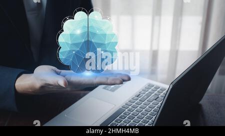 Businessman holding human brain on his hand with logistics symbols ...