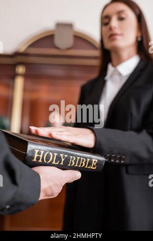 Bailiff giving oath to witness Stock Photo - Alamy