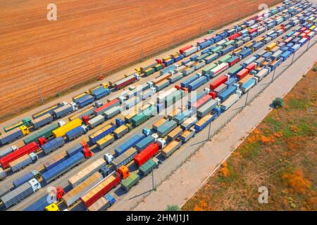A large number of trucks near the port terminal. Traffic jam on the ...