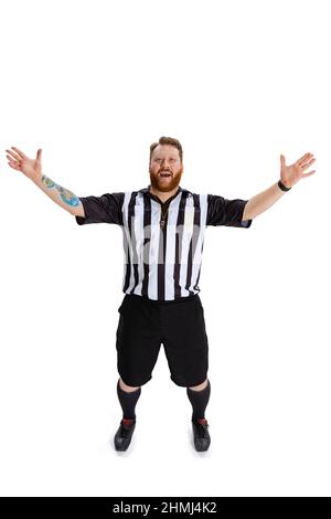 Full length portrait of a football referee with a smartphone with ...