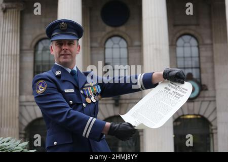 A copy of the 1916 proclamation is held up for photographers after a ...
