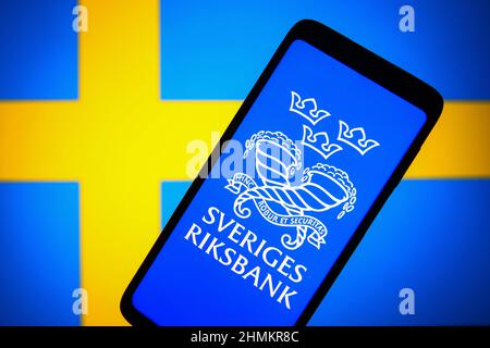 In this photo illustration, the Sveriges Riksbank logo seen displayed ...