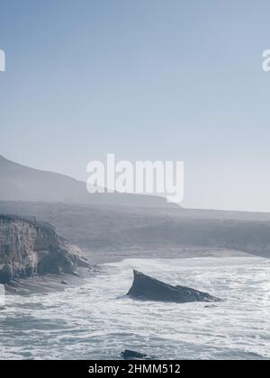 A natural view of strong waves hitting the shore at summertime Stock ...