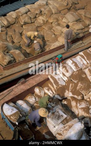 Worker offload Sand for Construction off a Transport ship at the ...