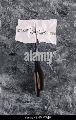 Manipulation text on crumpled piece of paper which is getting cut with ...